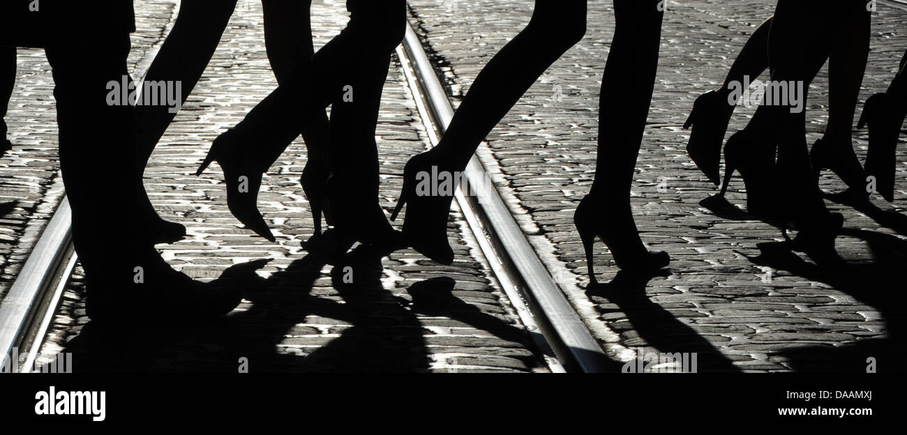 Entrants in Miss Germany beauty pageant walk over a cobbled street in ...