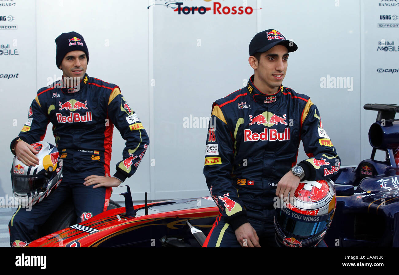 Swiss Formula One race driver Sebastien Buemi (r) and his Spanish team ...
