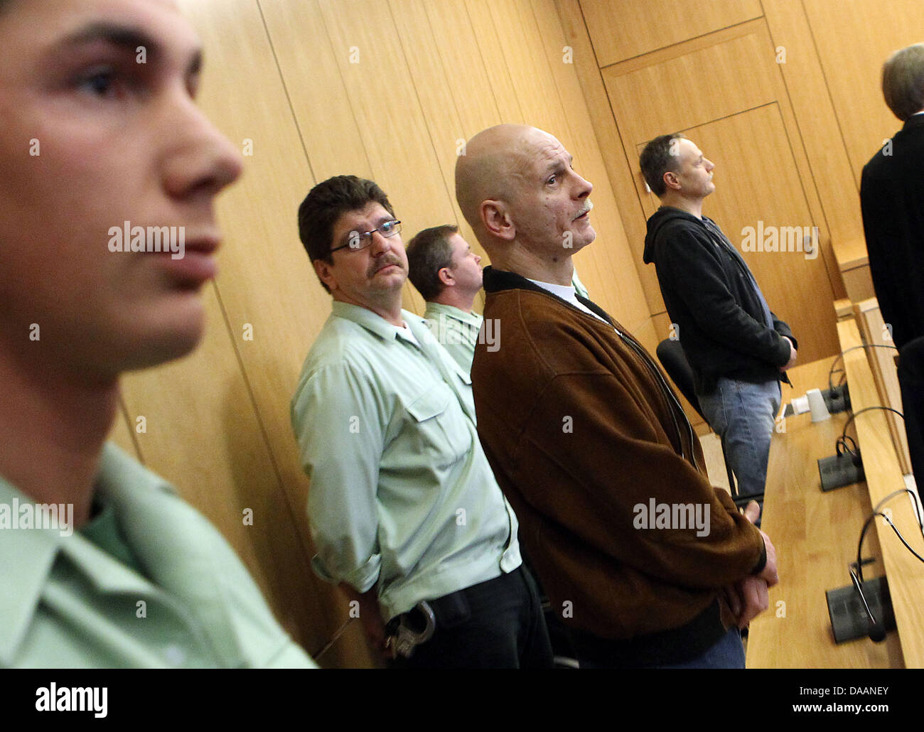 Defendants Peter Paul Michalski (C) and Michael Heckhoff (back) wait ...