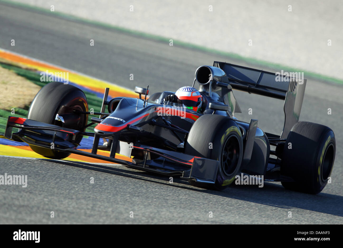 Indian Formula One rookie Narain Karthikeyan of HRT on track in the new ...