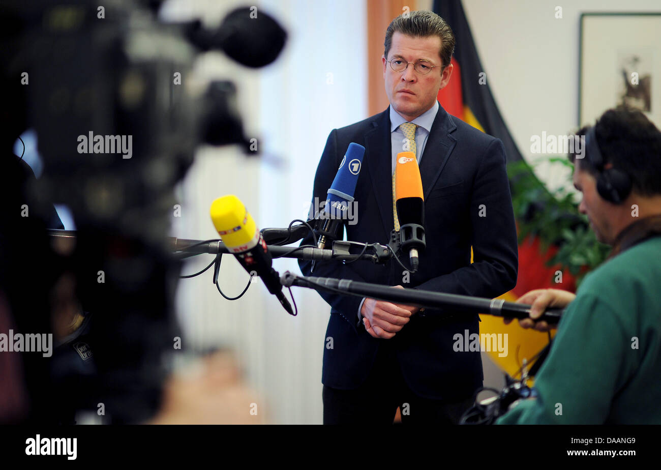 German Minister of Defence Karl-Theodor zu Guttenberg speaks to ...