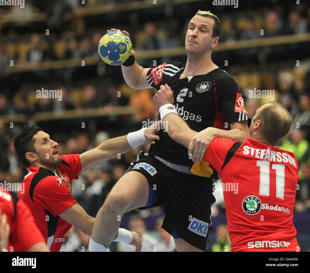 Pascal Hens (C) of Germany against Olafur Stefansson (R) and Alexander ...