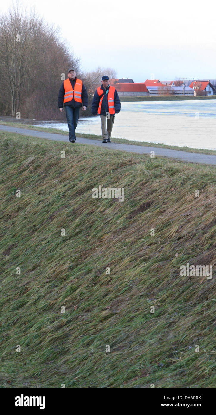 Two dike runners check the dike at the Elbe in Magdeburg, Germany, 22 ...