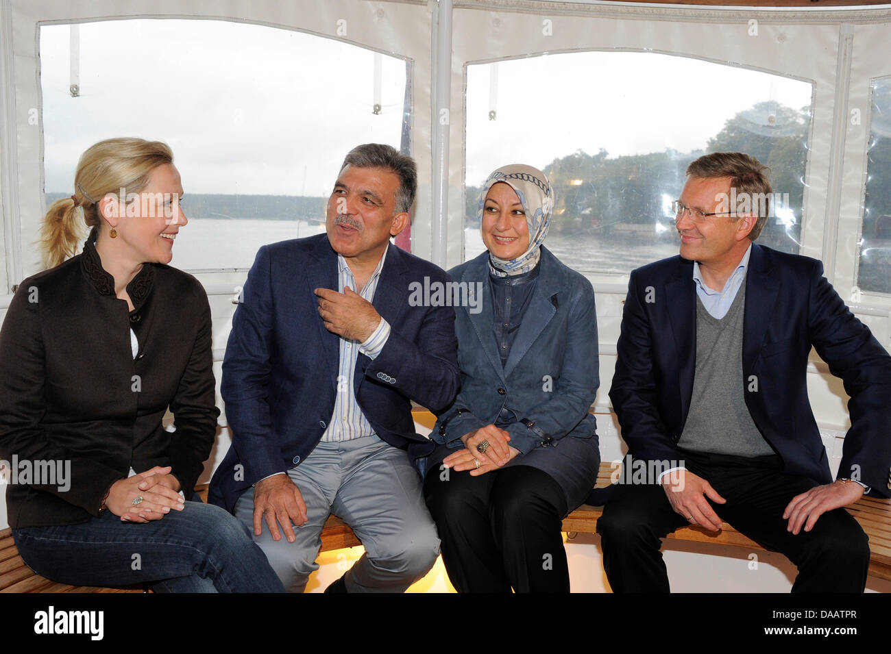 President of Turkey Abdullah Gul (2-L) and his wife Hayrunisa talk to ...