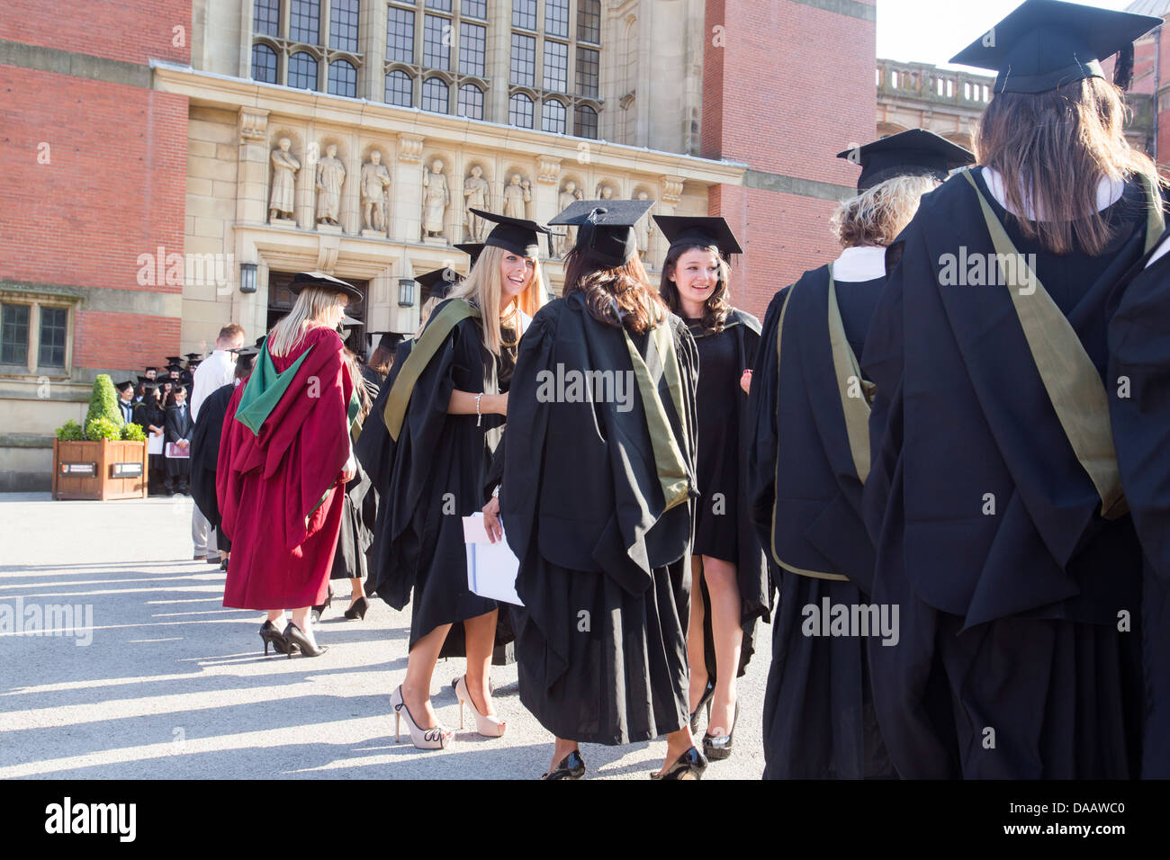 Smiling group of female graduates with gown hi-res stock photography ...