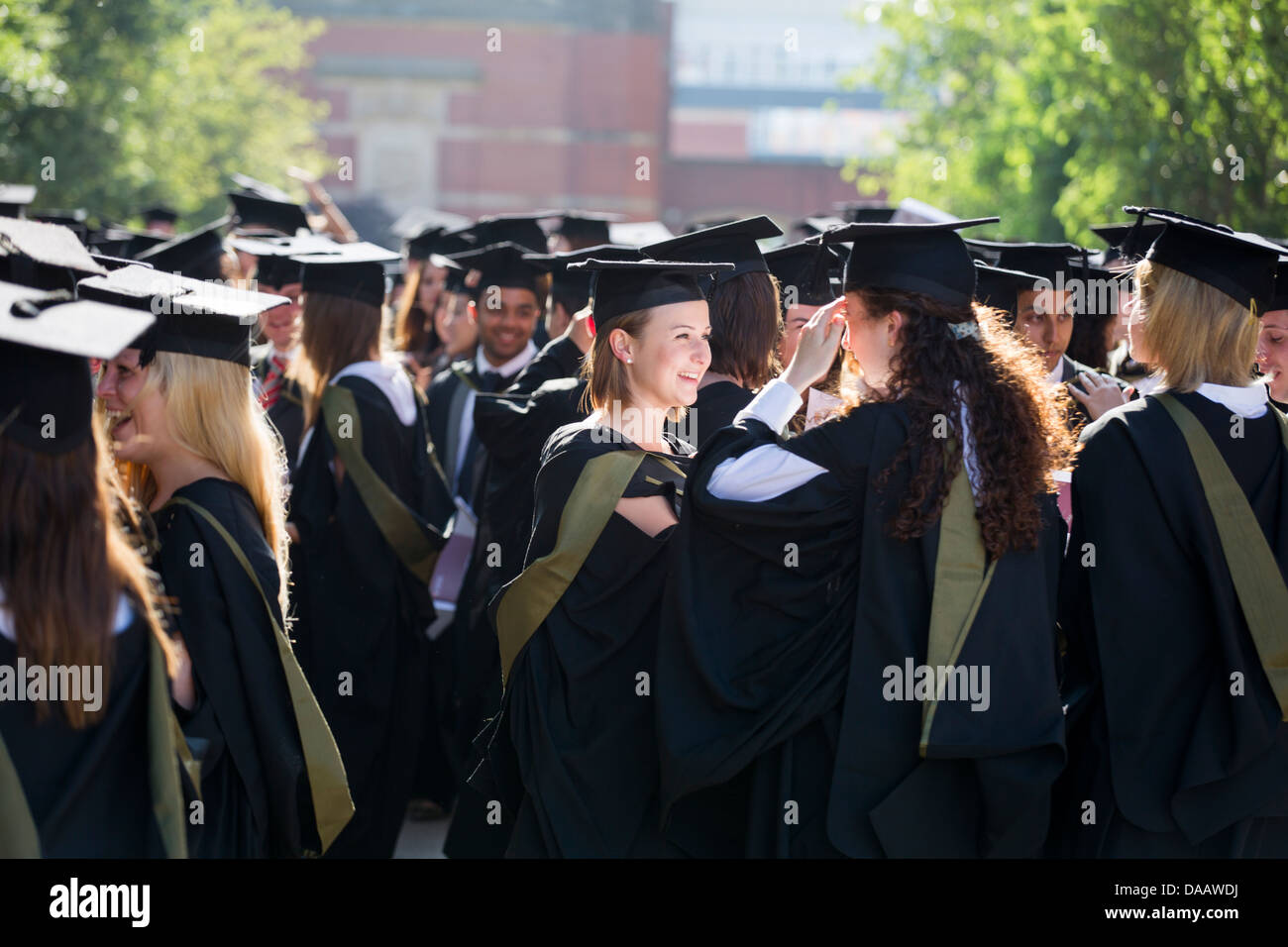 Graduates from Birmingham University, UK, mingle after the graduation ...