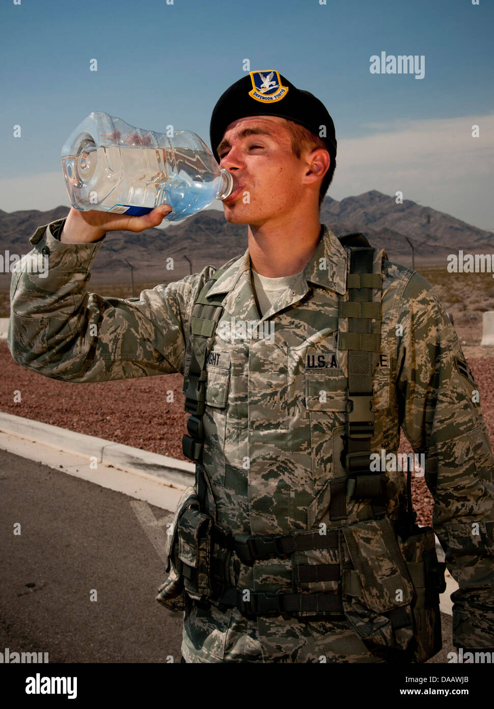Airman 1st Class Jeffrey Albright, 99th Security Forces Squadron journeyman, drinks water in ...