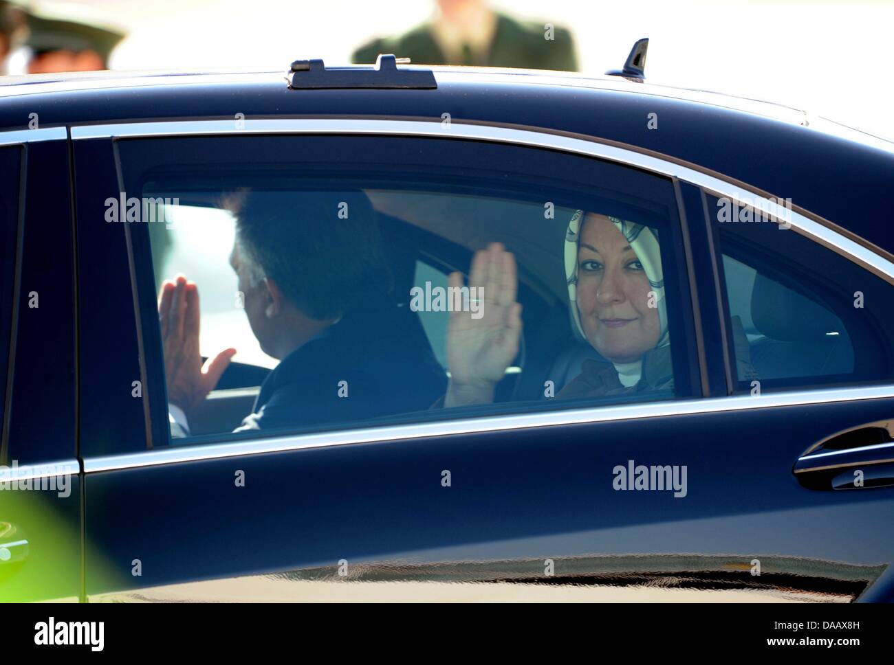 The Turkish President Abdullah Gul and his wife Hayrunnisa Gul wave ...