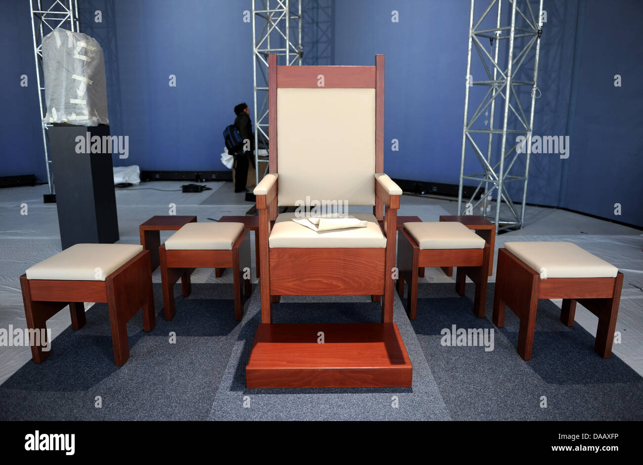 The papal chair is on the stage for the Pope's visit next to the ...