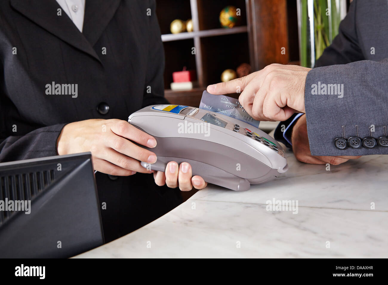 Hand of a man pulling credit card through card reader terminal Stock ...