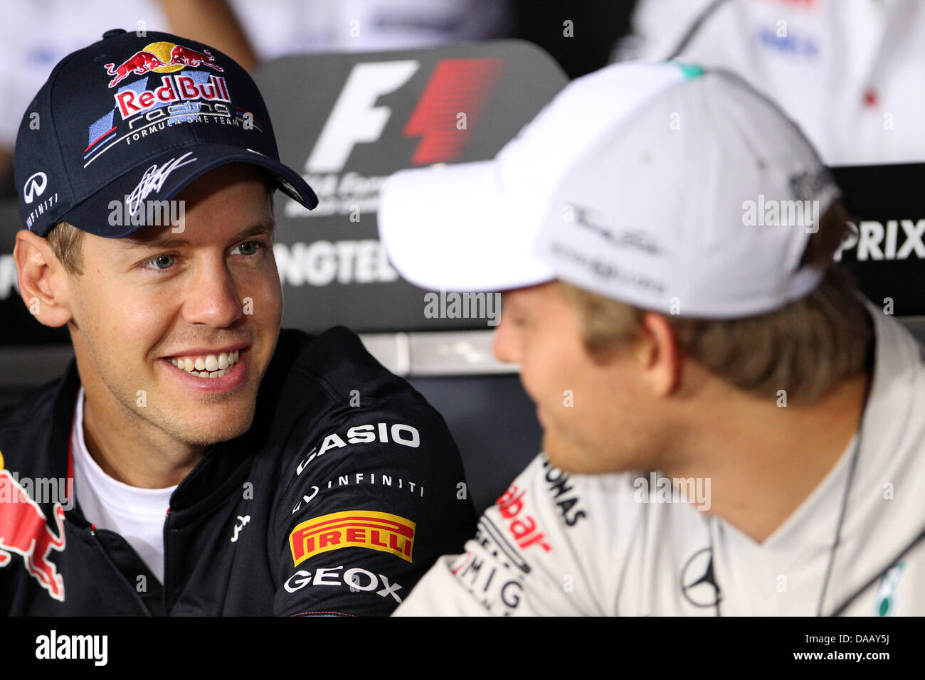 German Formula One driver Sebastian Vettel of Red Bull (L) talks to ...