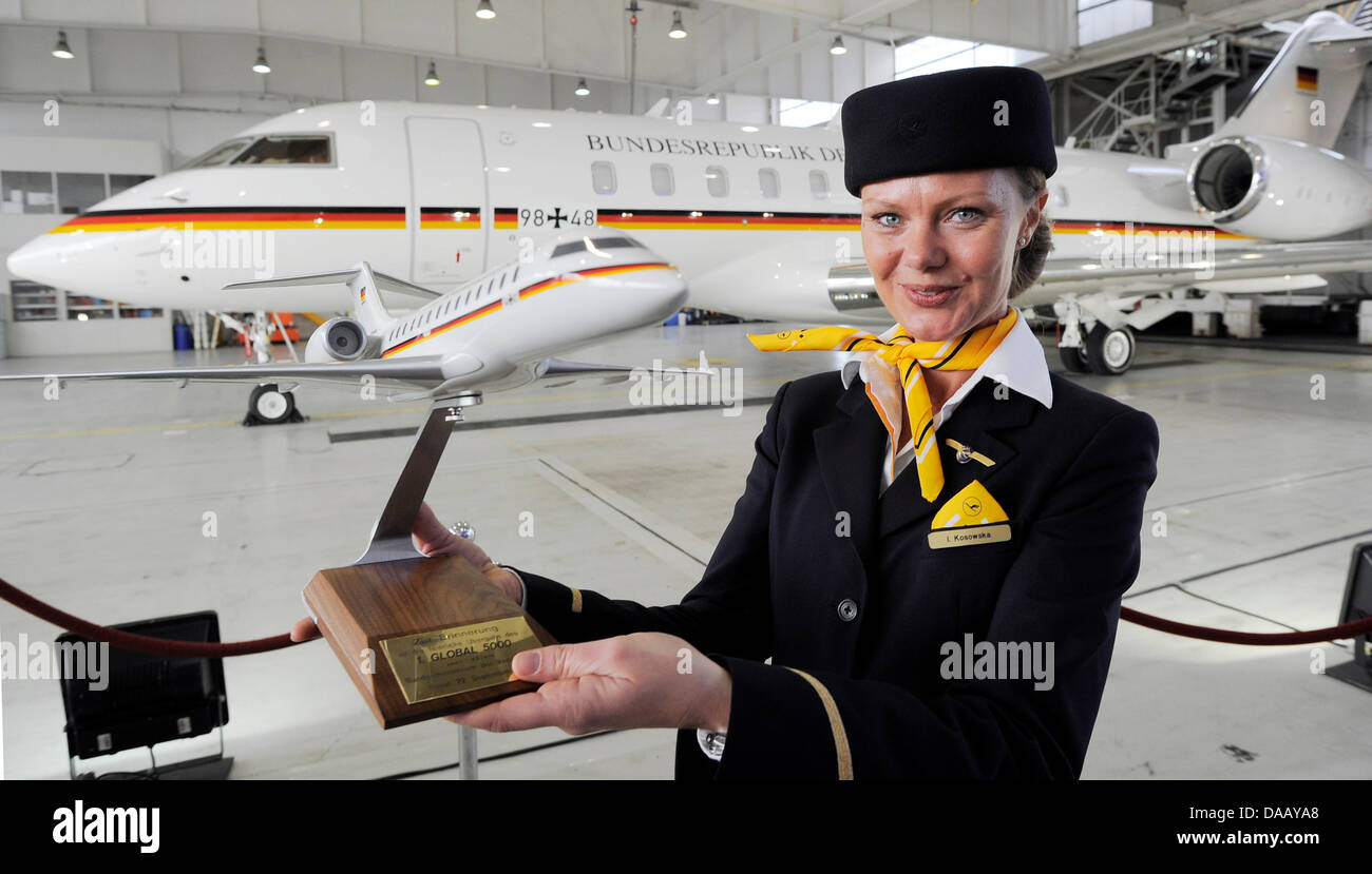 Stewardess Isabelle Kosowska stands in fron of the Bombardier Global ...