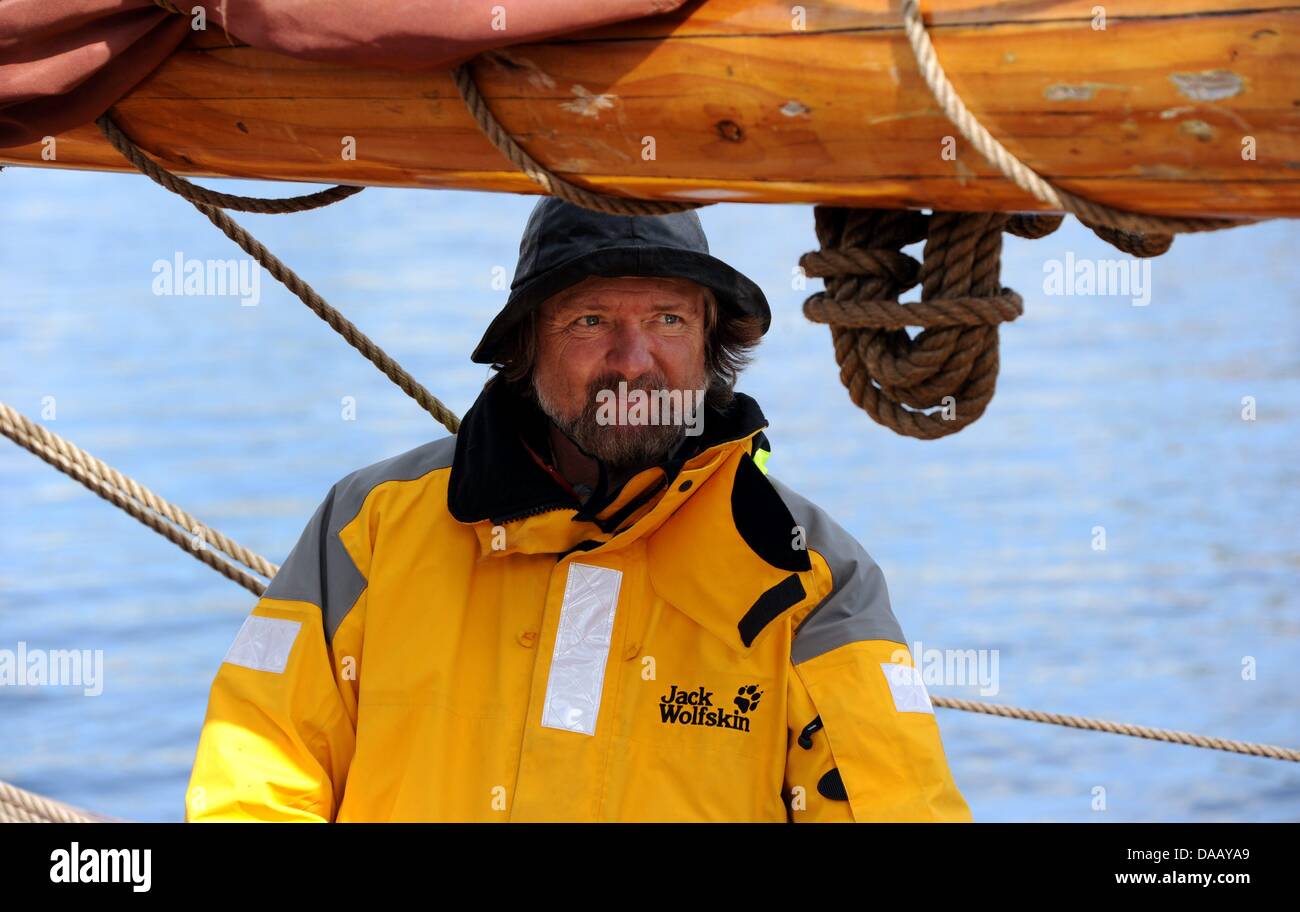 Adventurist and climate activist Arved Fuchs stands on his ship Dagmar ...
