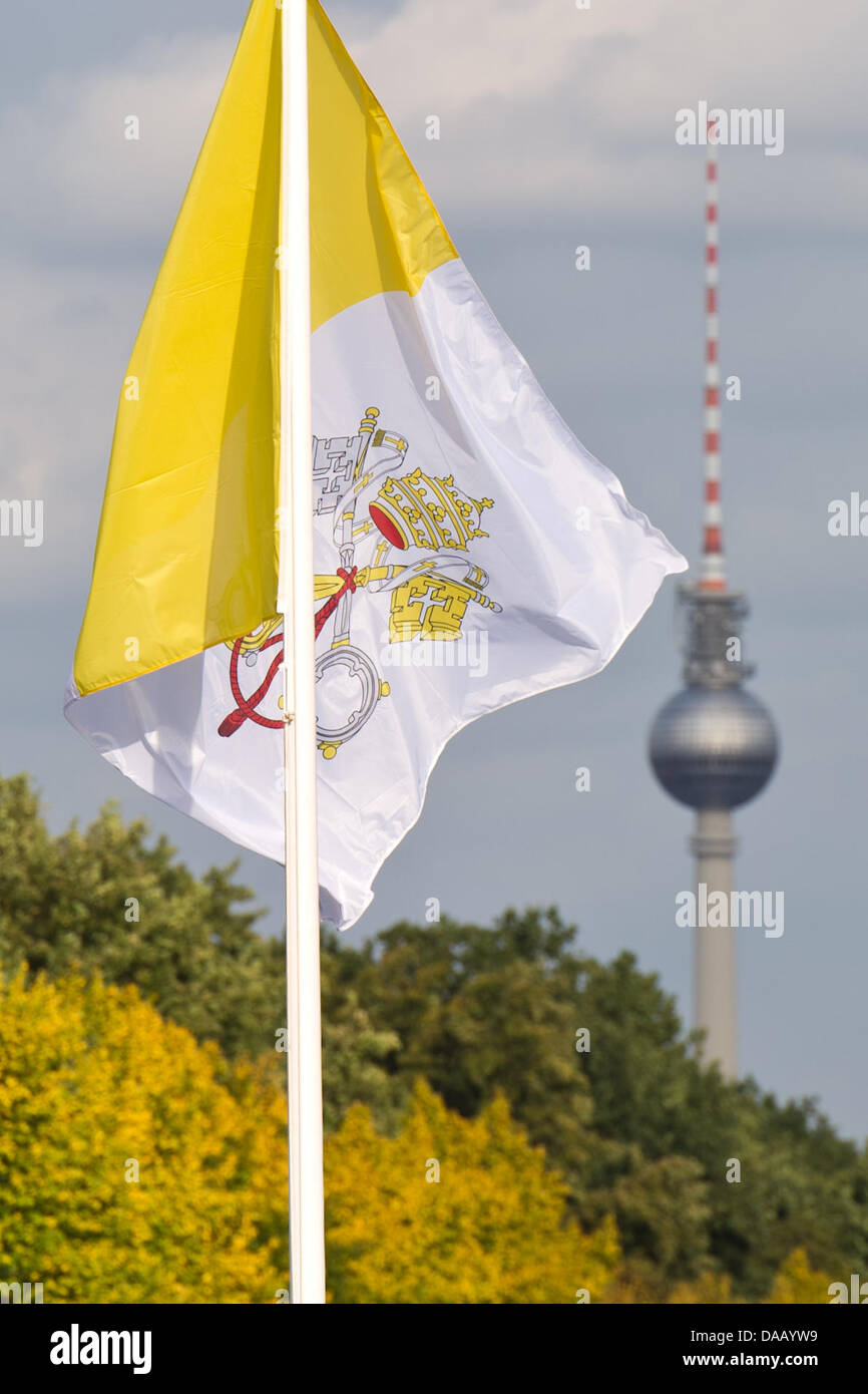 The Vatican flag is seen next to the Berlin TV tower in Berlin, Germany ...