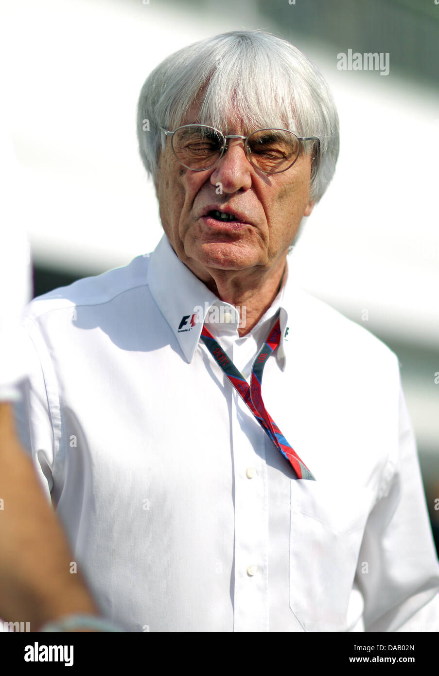 F1 supremo Bernie Ecclestone walks through the paddock at the race ...