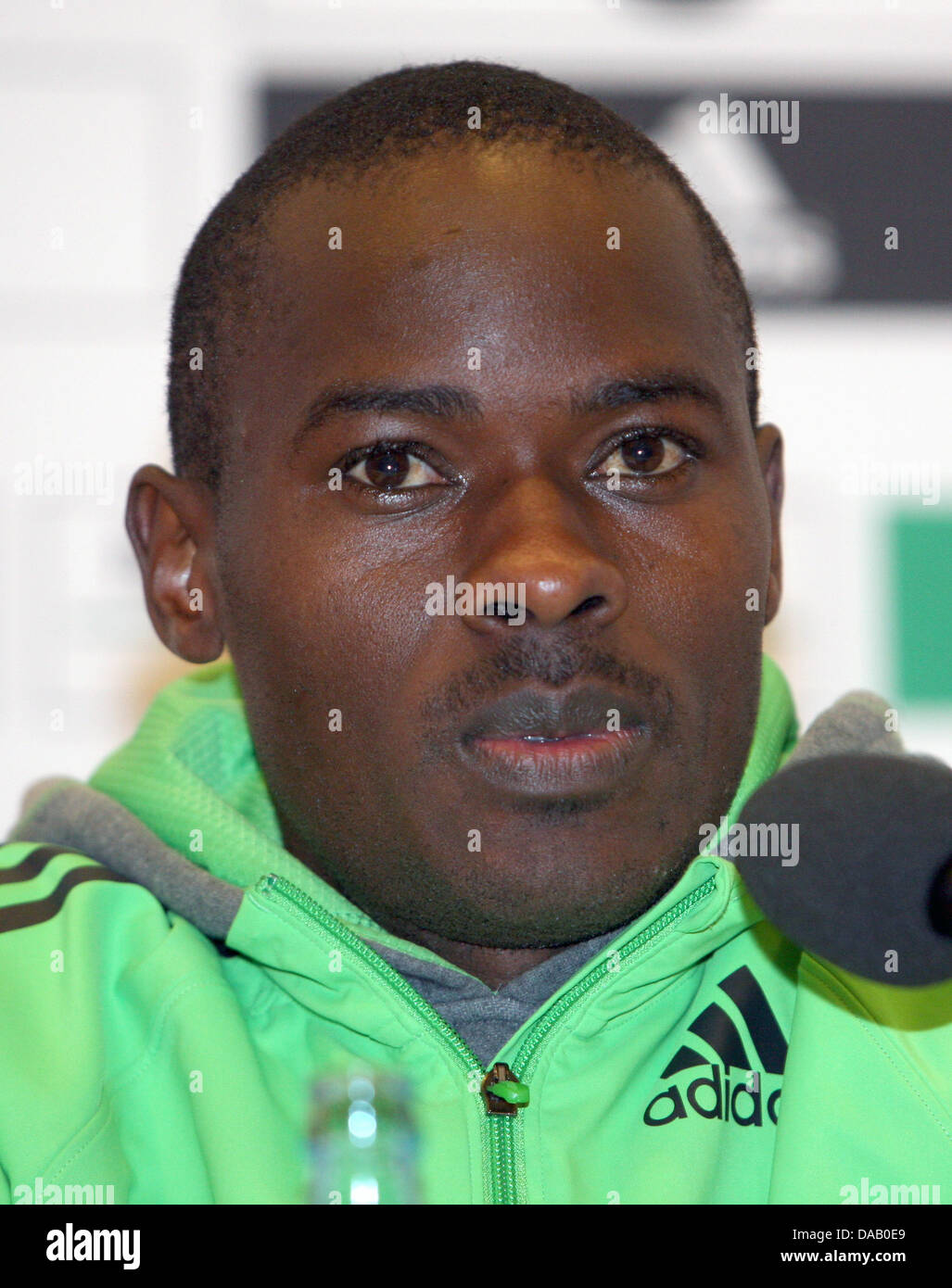 Kenian marathon athlete Patrick Makau smiles during a press conference ...