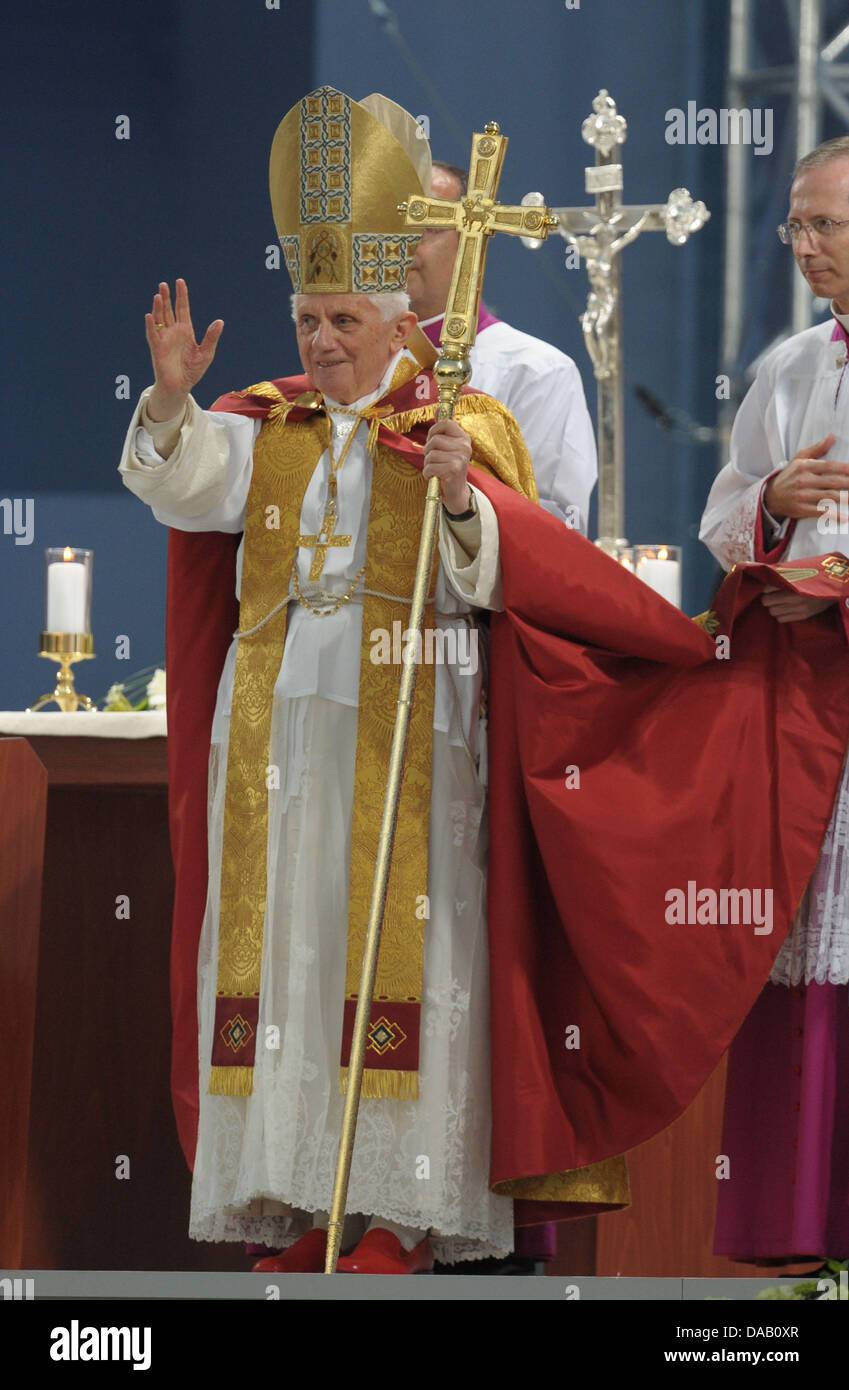 Pope Benedict XVI blesses the faithful during the mass near the ...