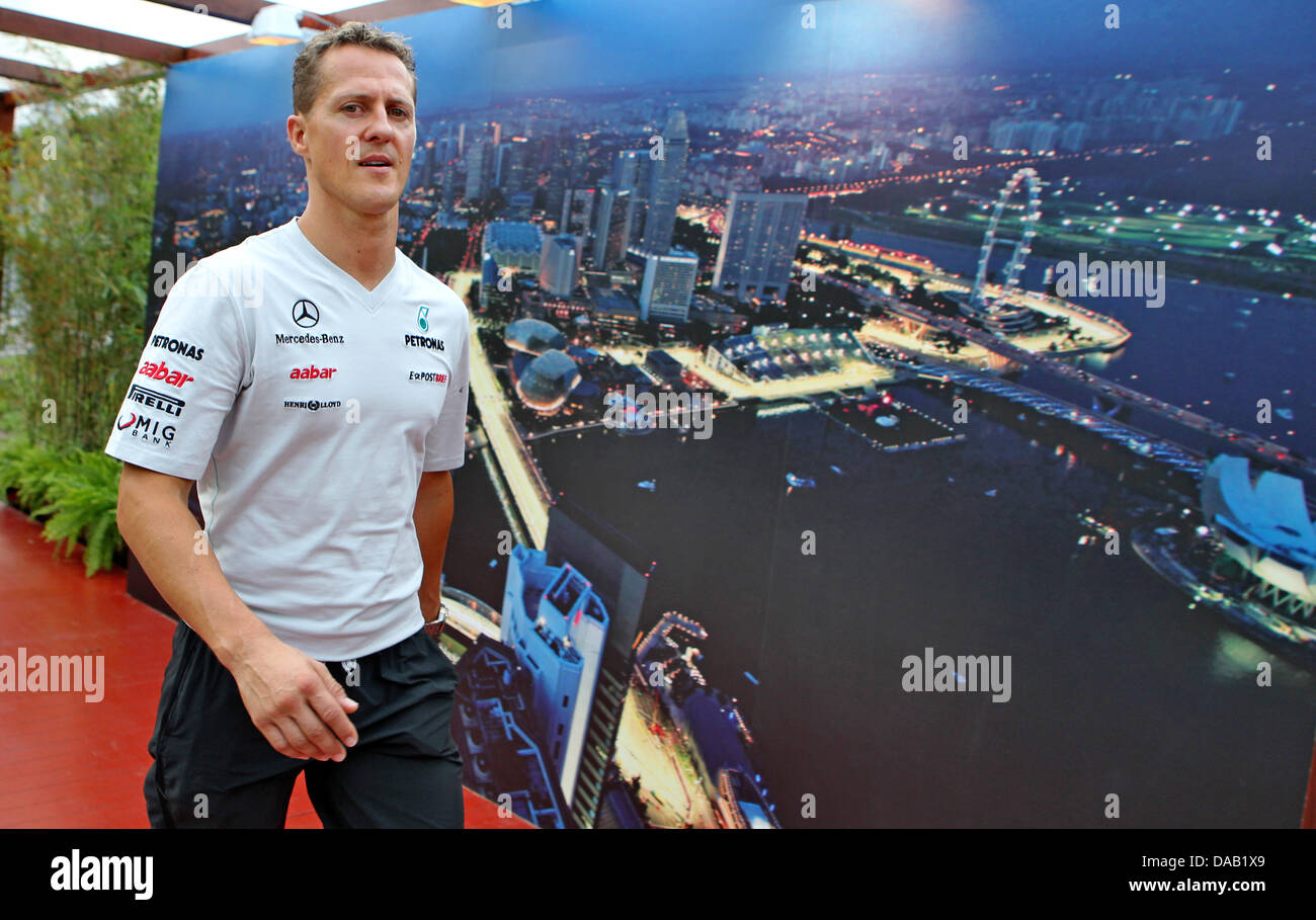 German Formula One driver Michael Schumacher of Mercedes GP walks ...