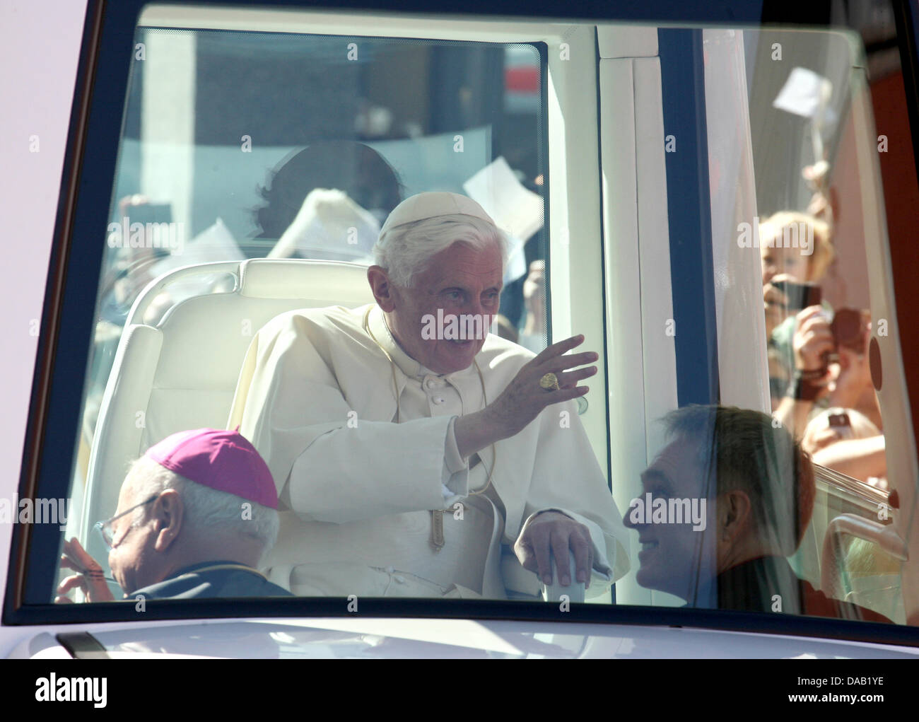 Pope Benedict XVI drives in the Papamobil on his way to visit Freiburg ...