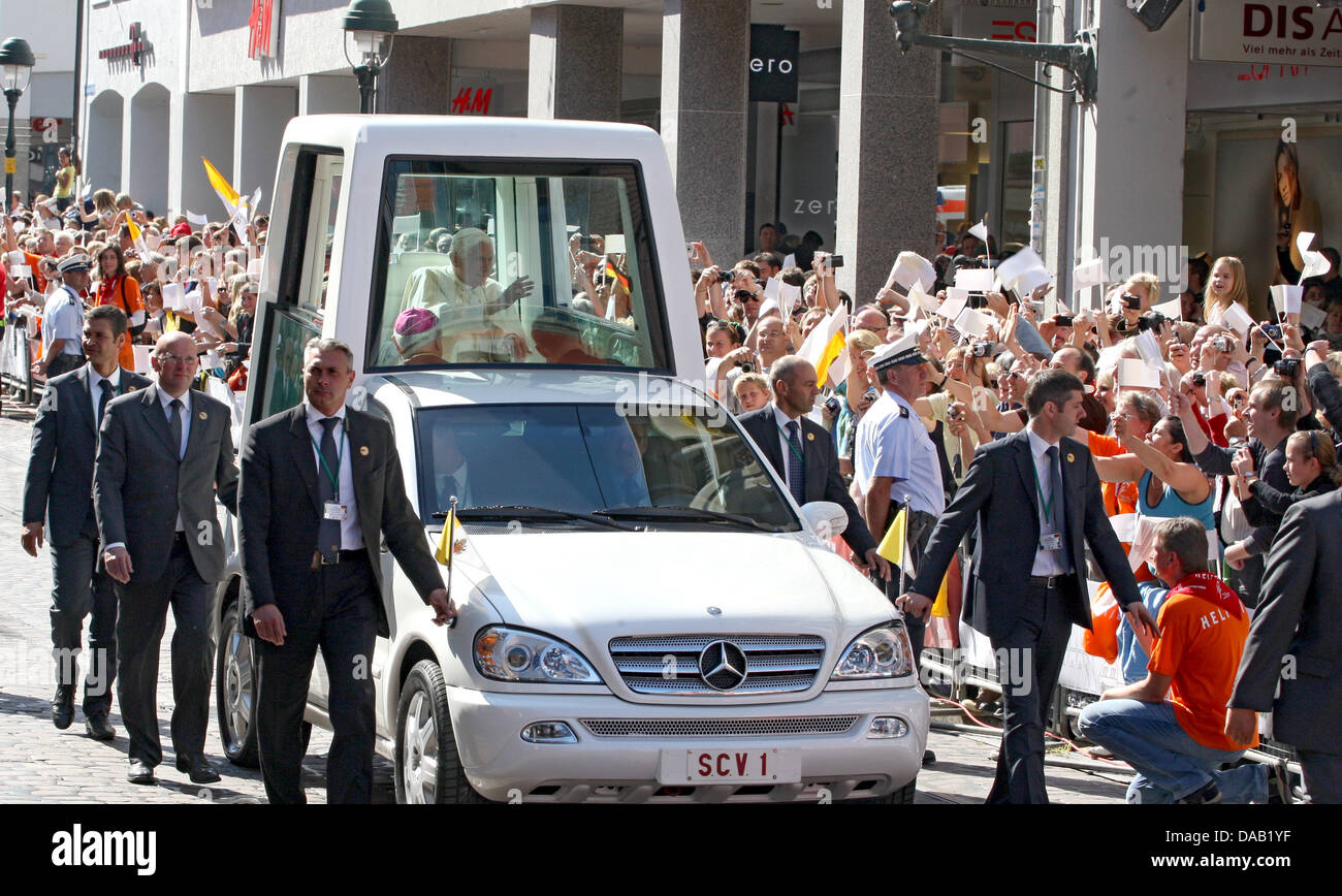 Pope Benedict XVI drives in the Papamobil on his way to visit Freiburg ...