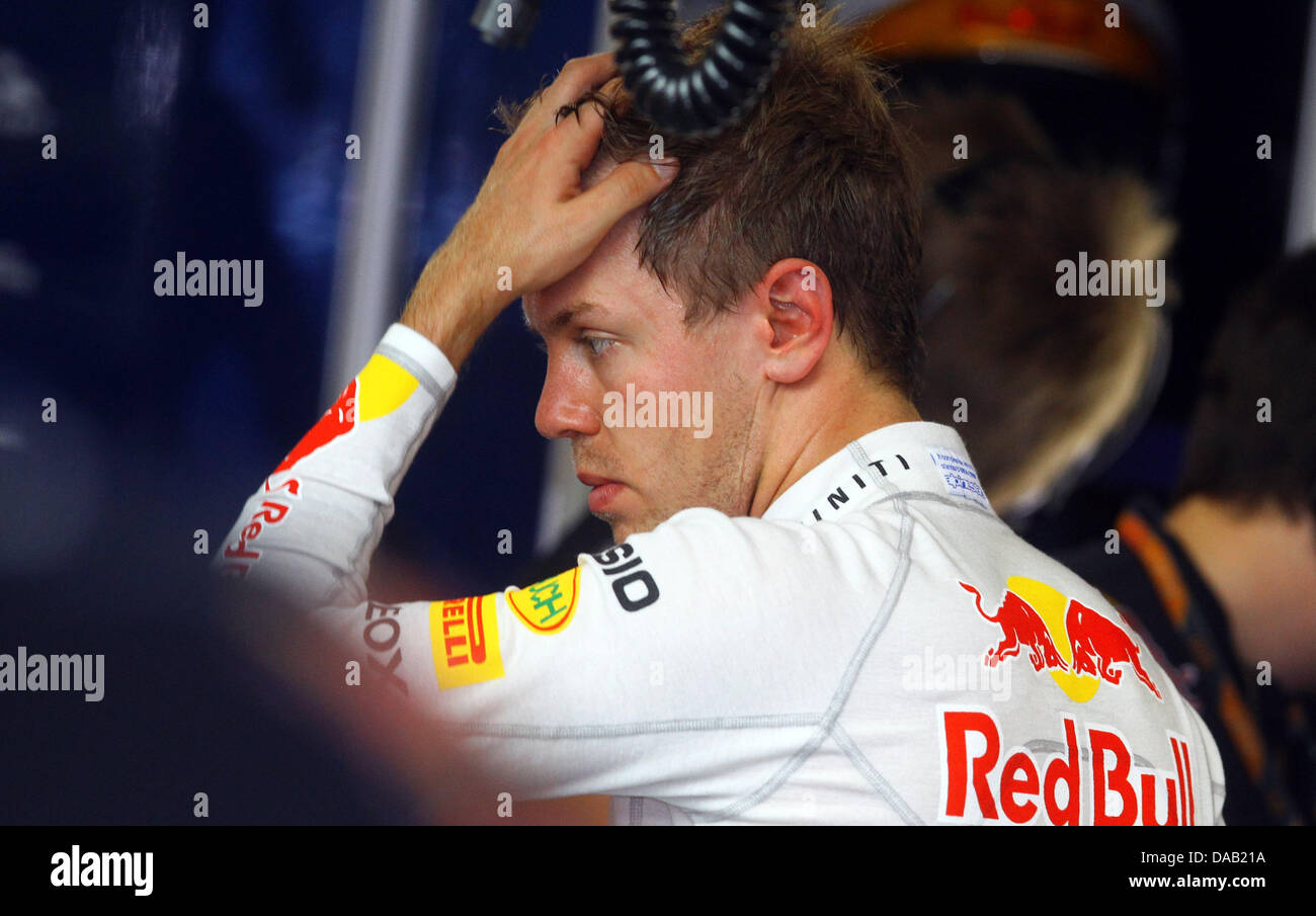 German Formula One driver Sebastian Vettel of Red Bull reacts after the ...