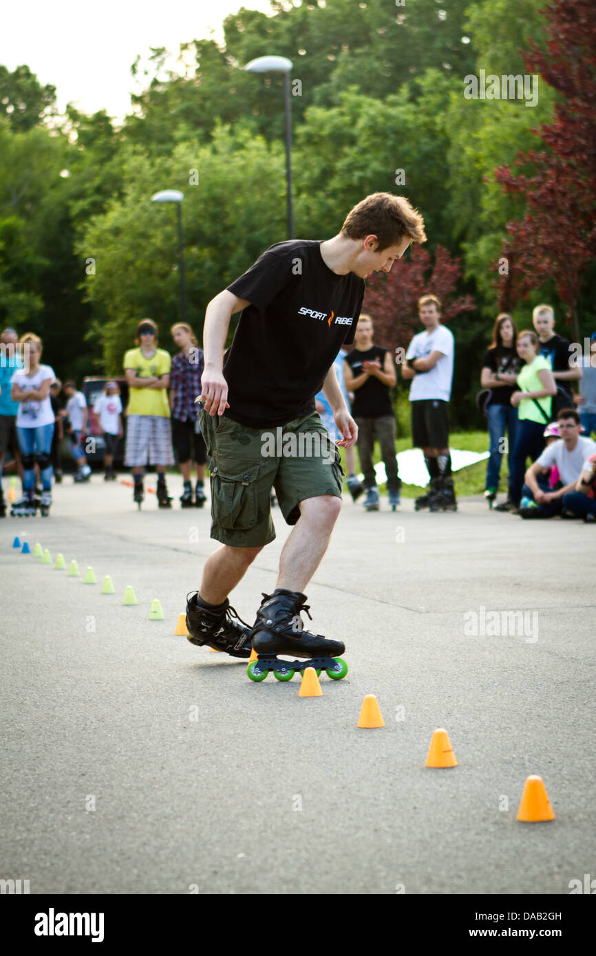 Young man roller skating hi-res stock photography and images - Alamy