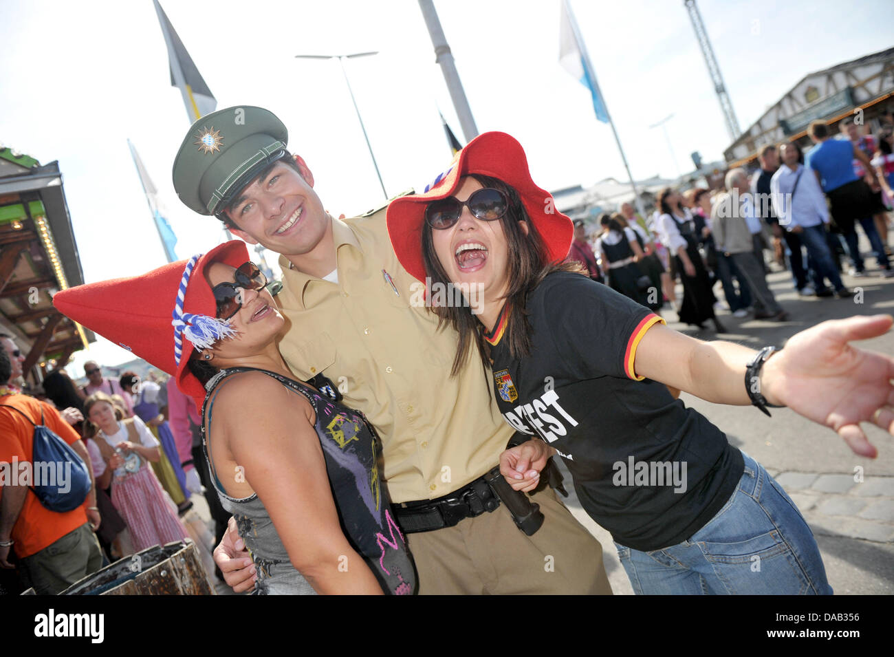 A police officer poses at the Oktoberfest beer festival on the ...