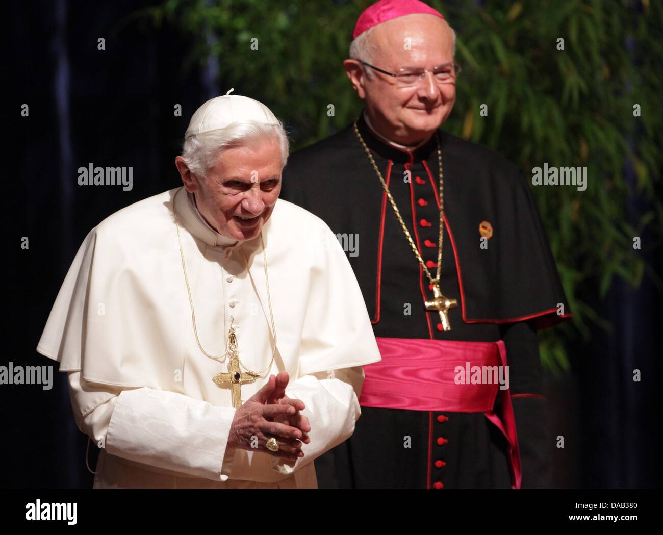 Pope Benedict XVI (L) wave to the crowd after he delivers a speech in ...