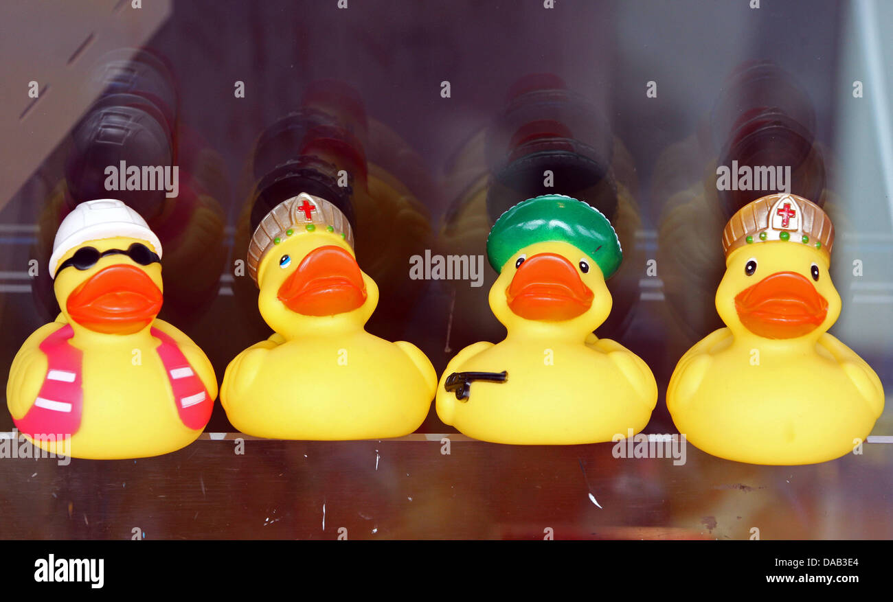 Four rubber ducks are on display waiting for a customer to pass by in a ...