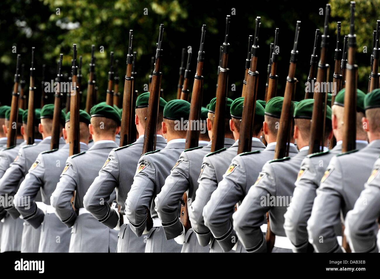 Troops of the Bundeswehr's Guards Regiment stand at attention for a ...