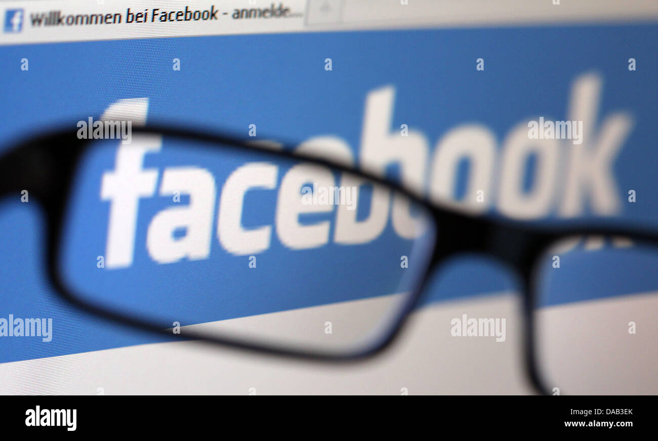 The ILLUSTRATION shows the Facebook logo seen through the lens of a ...