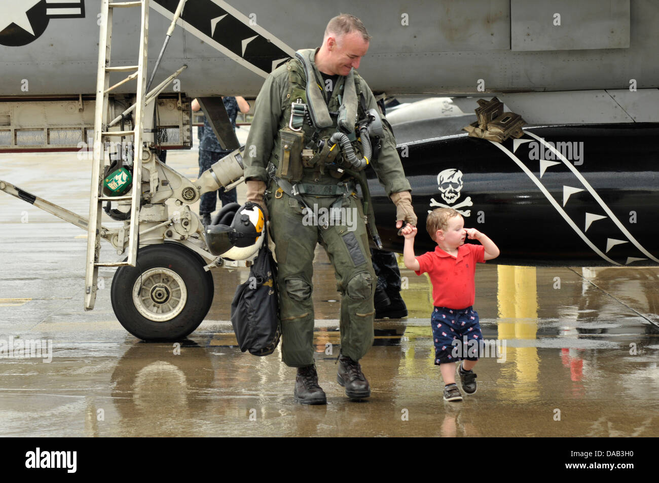 Lt. Cmdr. Ed Brush, from Strike Fighter Squadron (VFA) 103, walks with ...