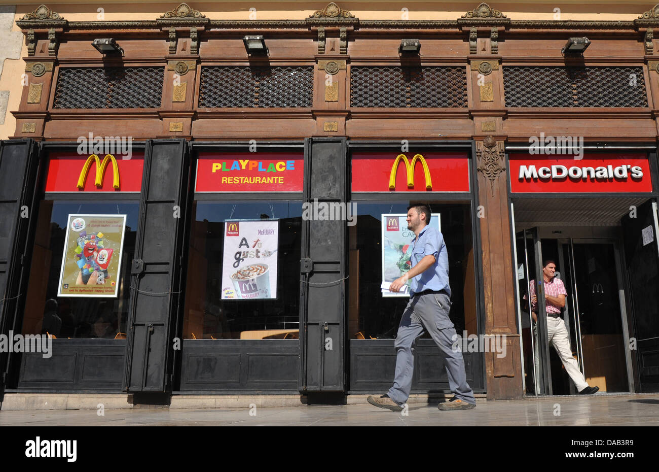 A man walks past a branch of McDonald's in Valencia, Spain, 14 ...