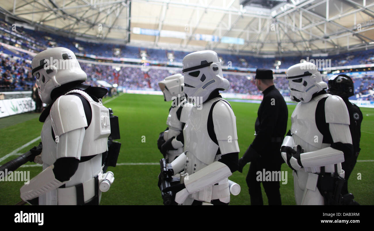 Actors dressed as imperial storm troops from the Star Wars movies walk ...