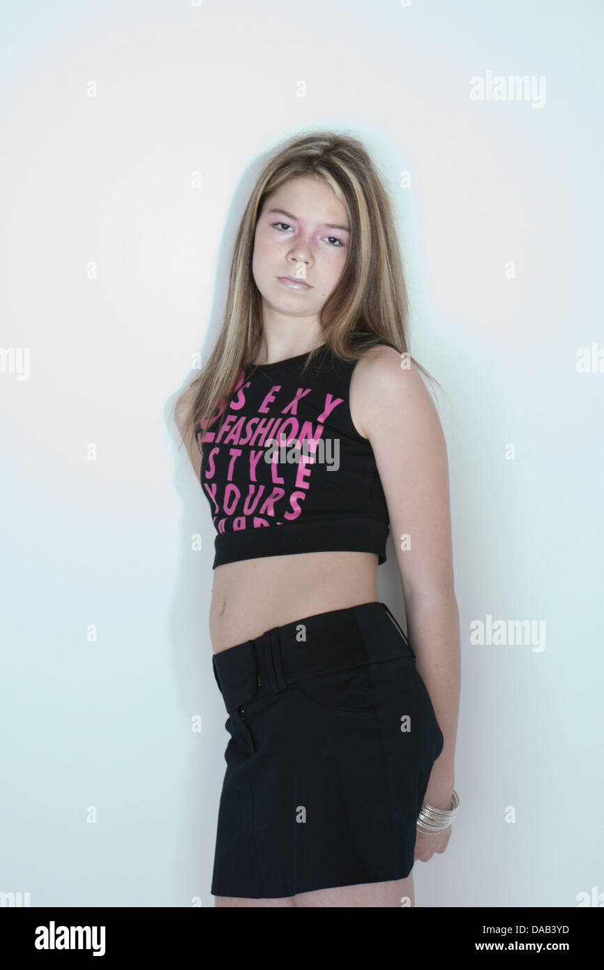 A pretty young tween american girl models some new clothing. She looks ... A pretty young tween american girl models some new clothing. She looks ...