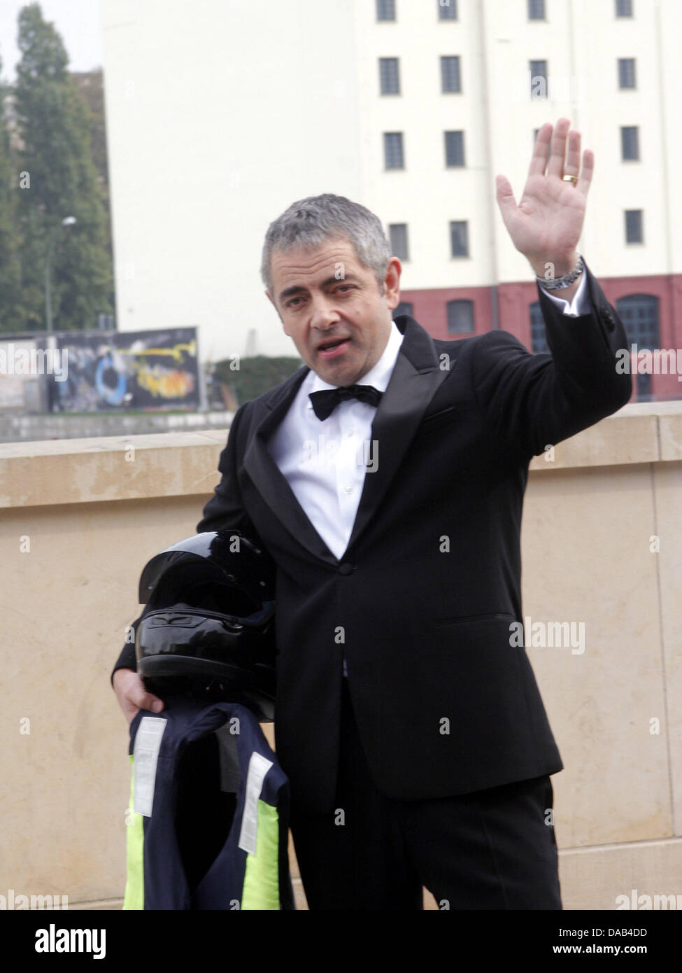British actor Rowan Atkinson waves during a photocall for his new film ...