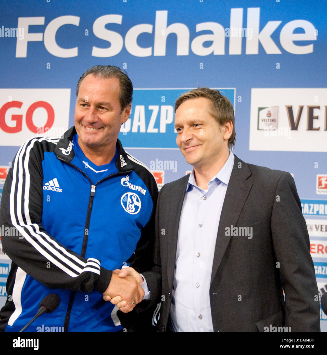 New head coach of FC Schalke 04, Huub Stevens (L), shakes hands with ...