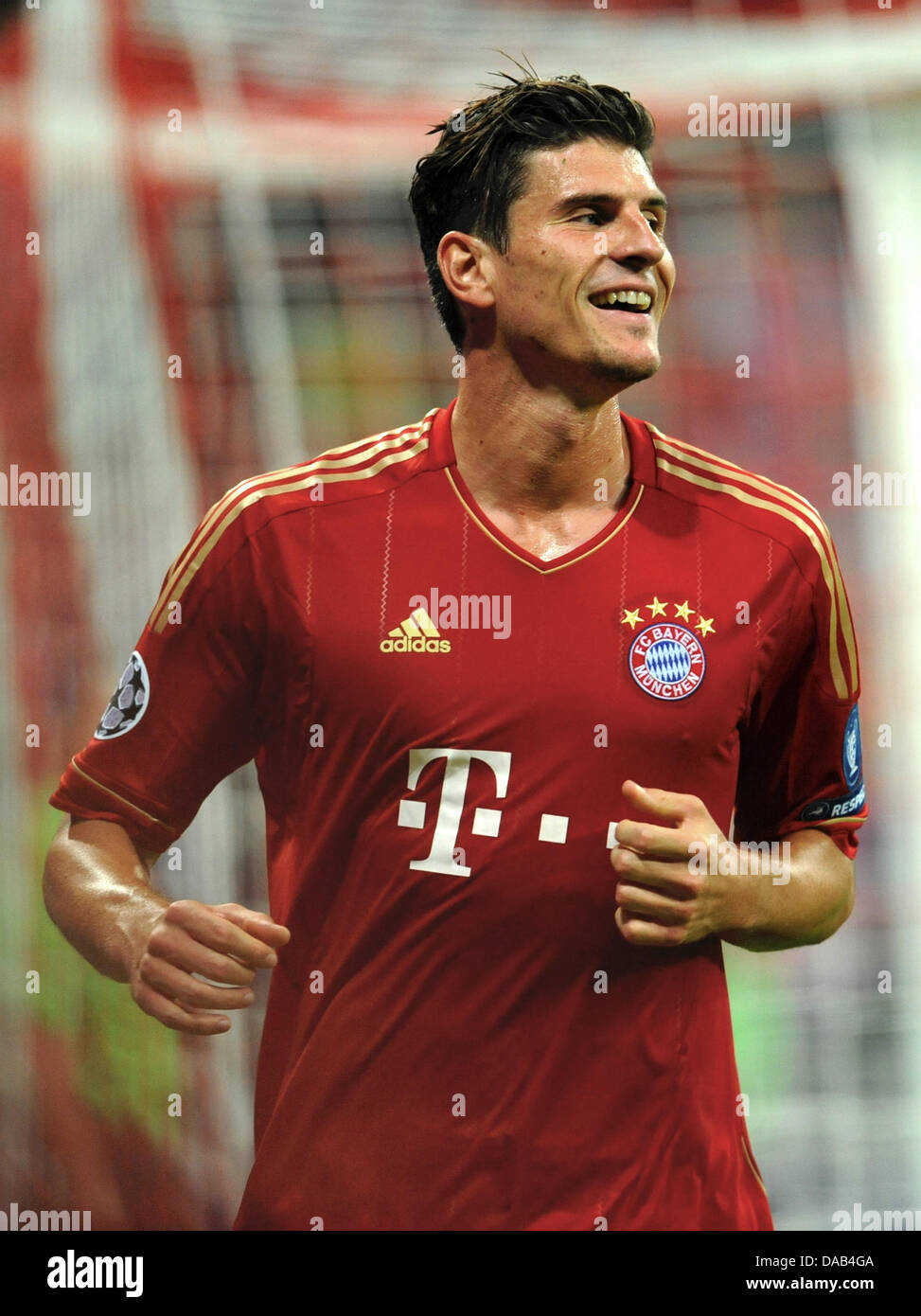 Munich's Mario Gomez celebrates his second goal during the Champions ...