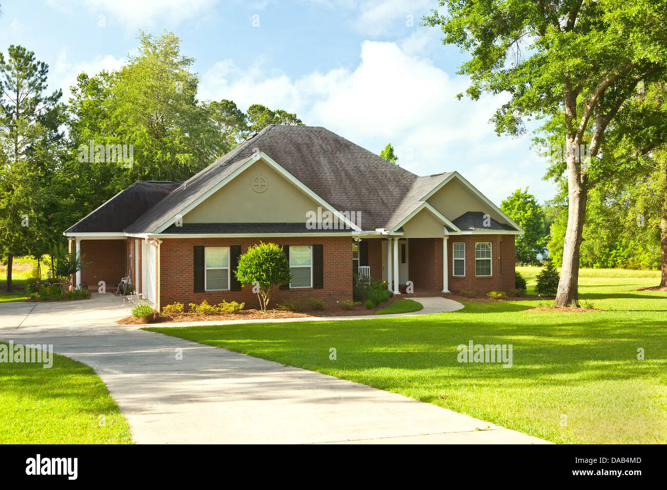 Traditional style country house with landscaping Stock Photo - Alamy