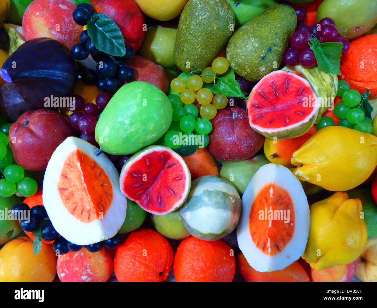 Colorful fruit-shaped soaps in vibrant hues, including melon, peach ...