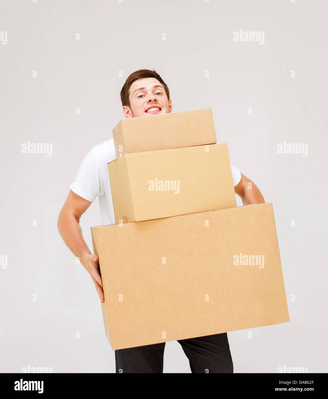 young man carrying carton boxes Stock Photo - Alamy