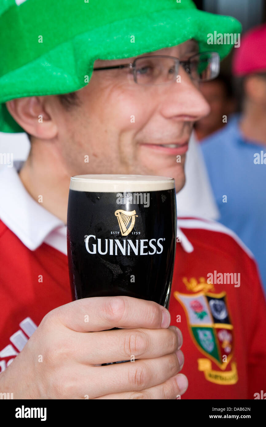 Man drinking a pint of Guinness stout beer on a Stag weekend in Dublin ...