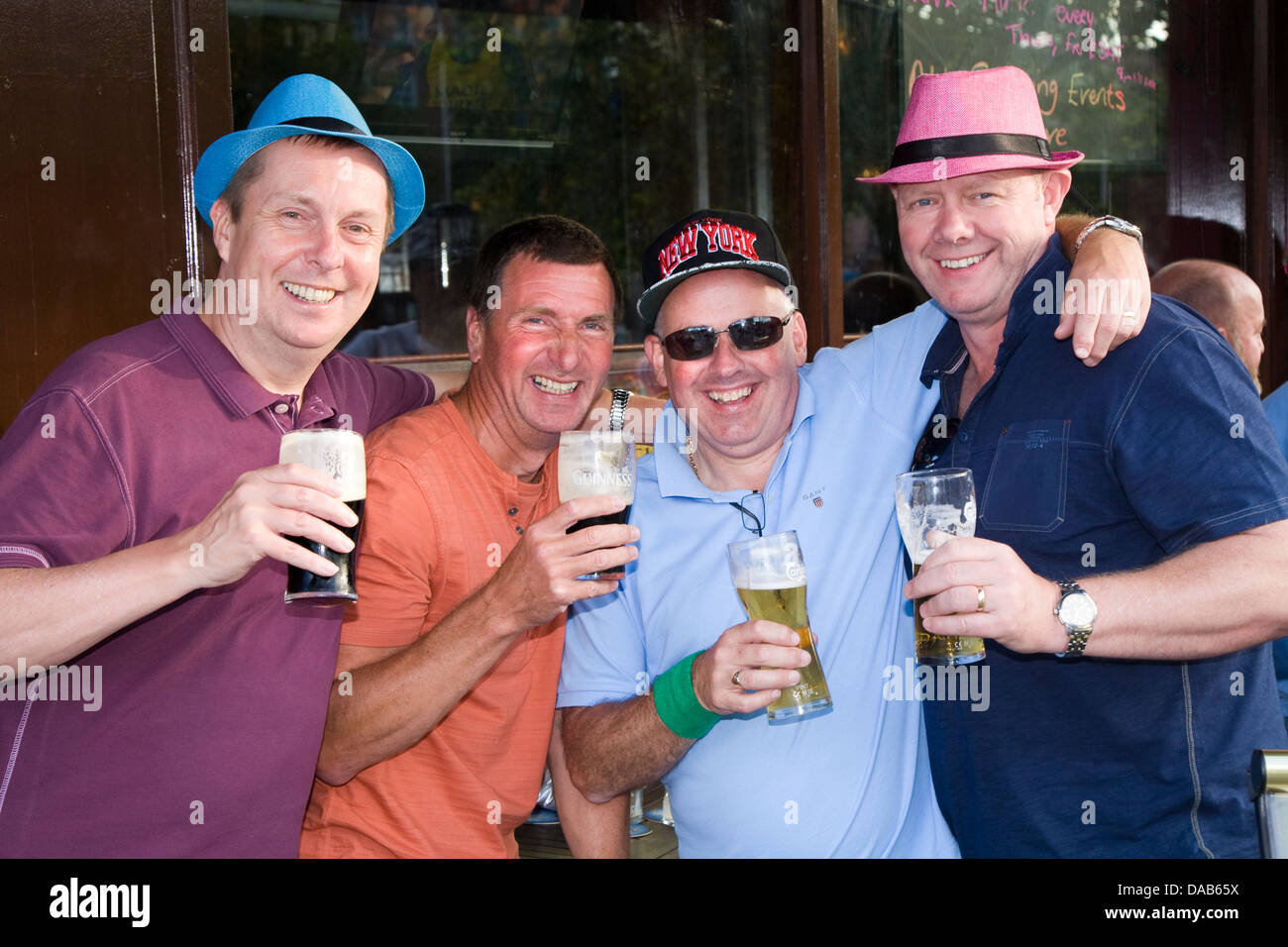 Raising a pint of guinness hi-res stock photography and images - Alamy