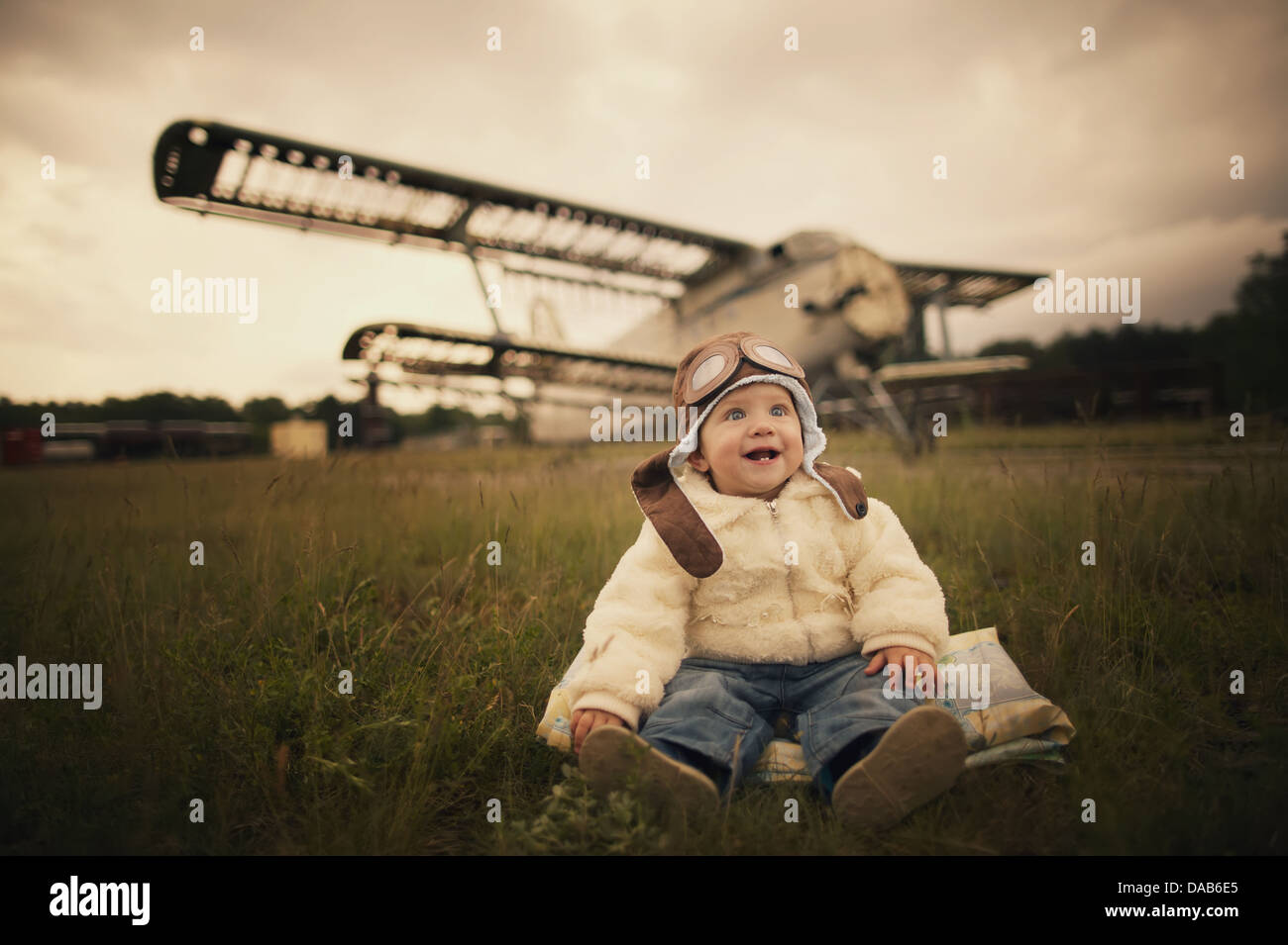 sweet little baby dreaming of being pilot Stock Photo - Alamy