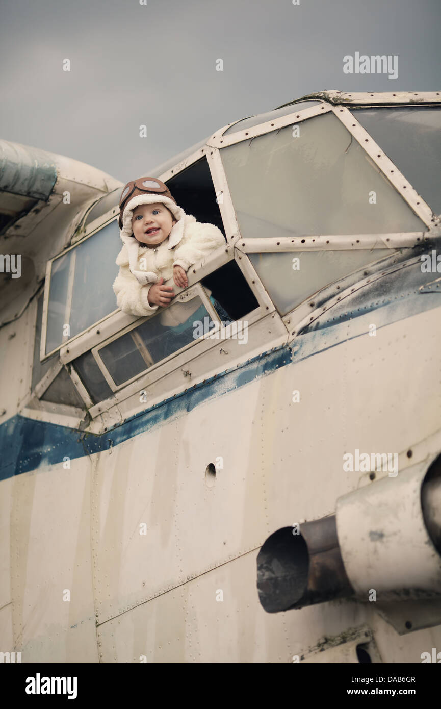sweet little baby dreaming of being pilot Stock Photo - Alamy
