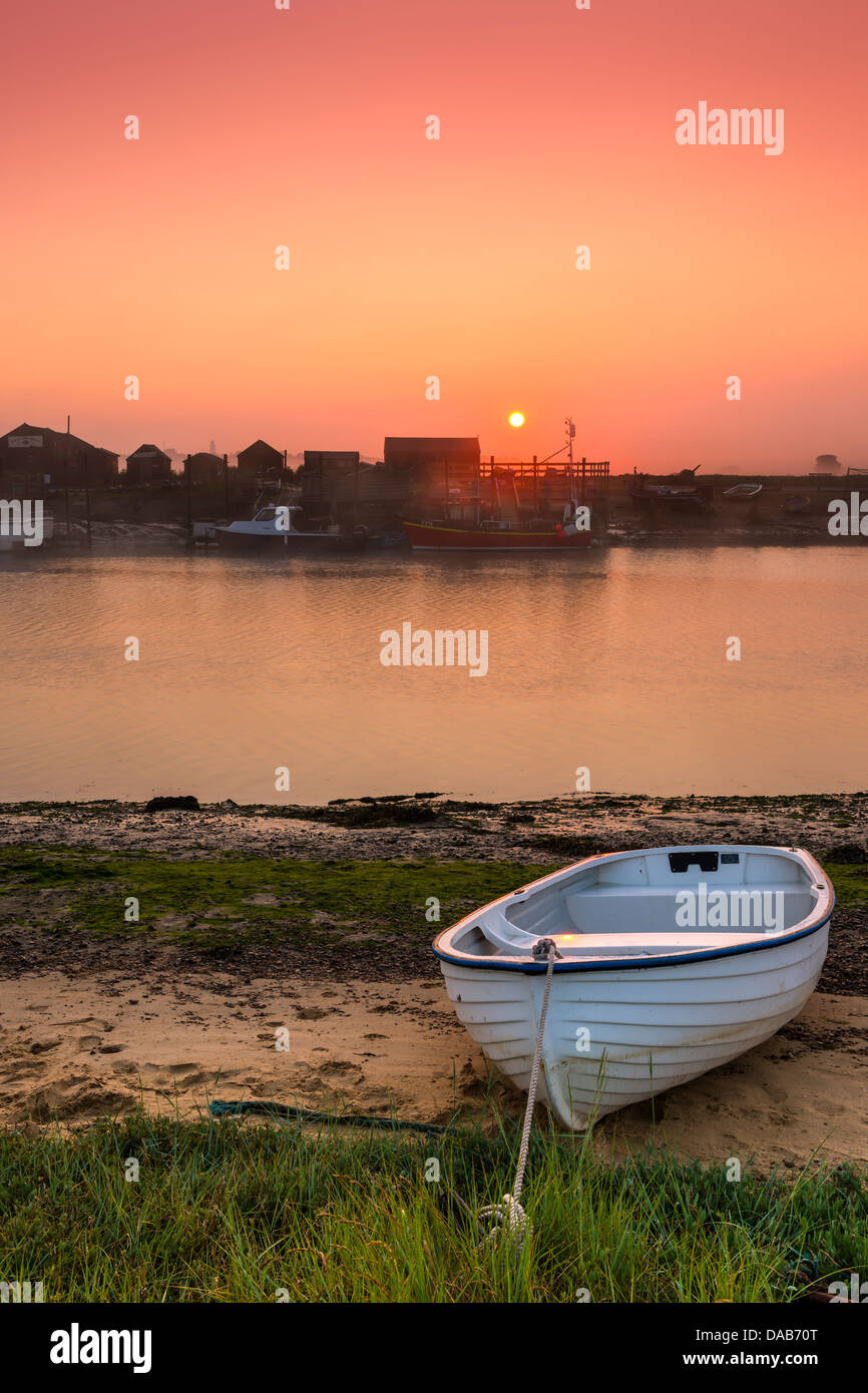 The sun rises over the little harbour at Blackshore in early July Stock ...