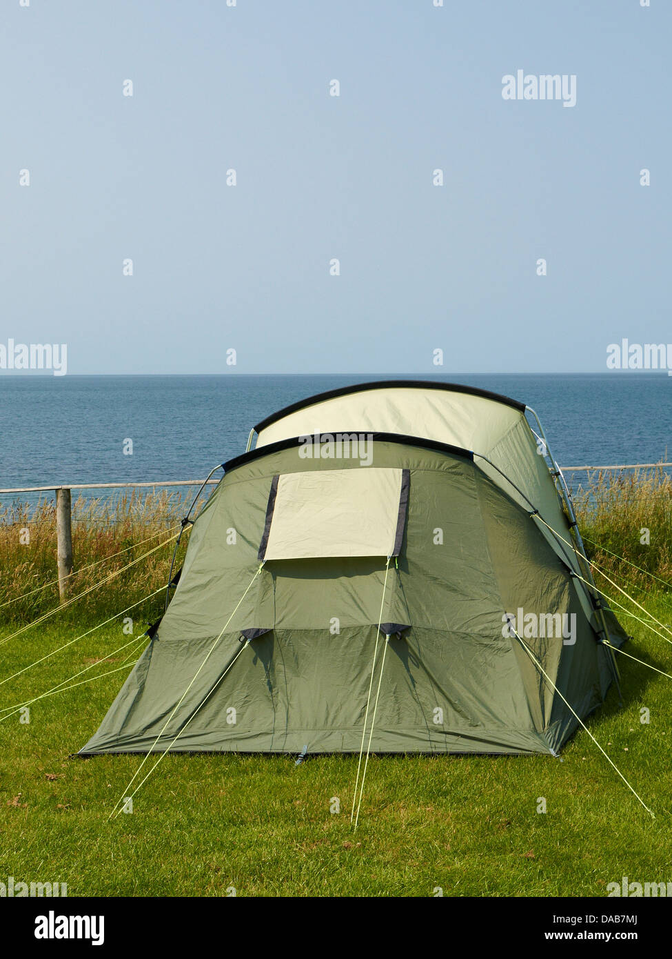 Single tent on seaside campsite with sea view Stock Photo - Alamy