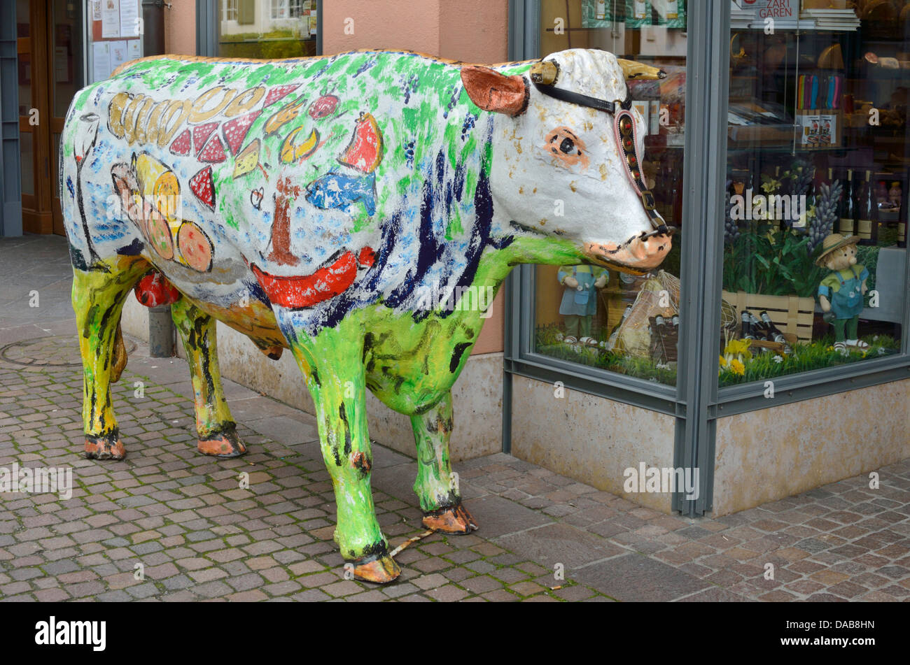 Life size painted model of a cow outside a Swiss butcher's shop Stock ...
