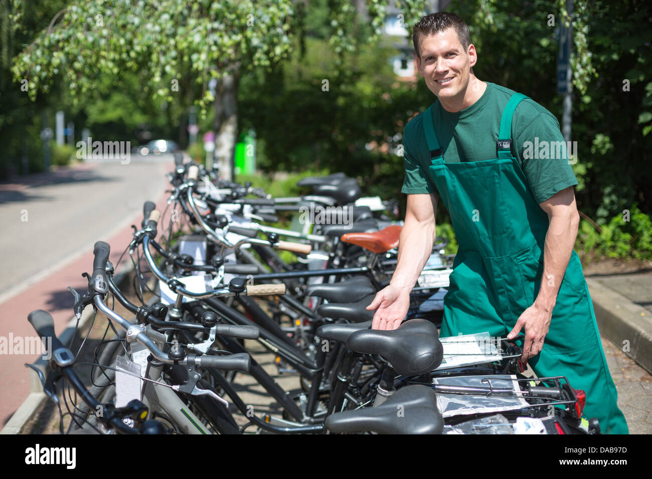 Bicycle presenting a collection of new bikes to customer in cycle shop ...