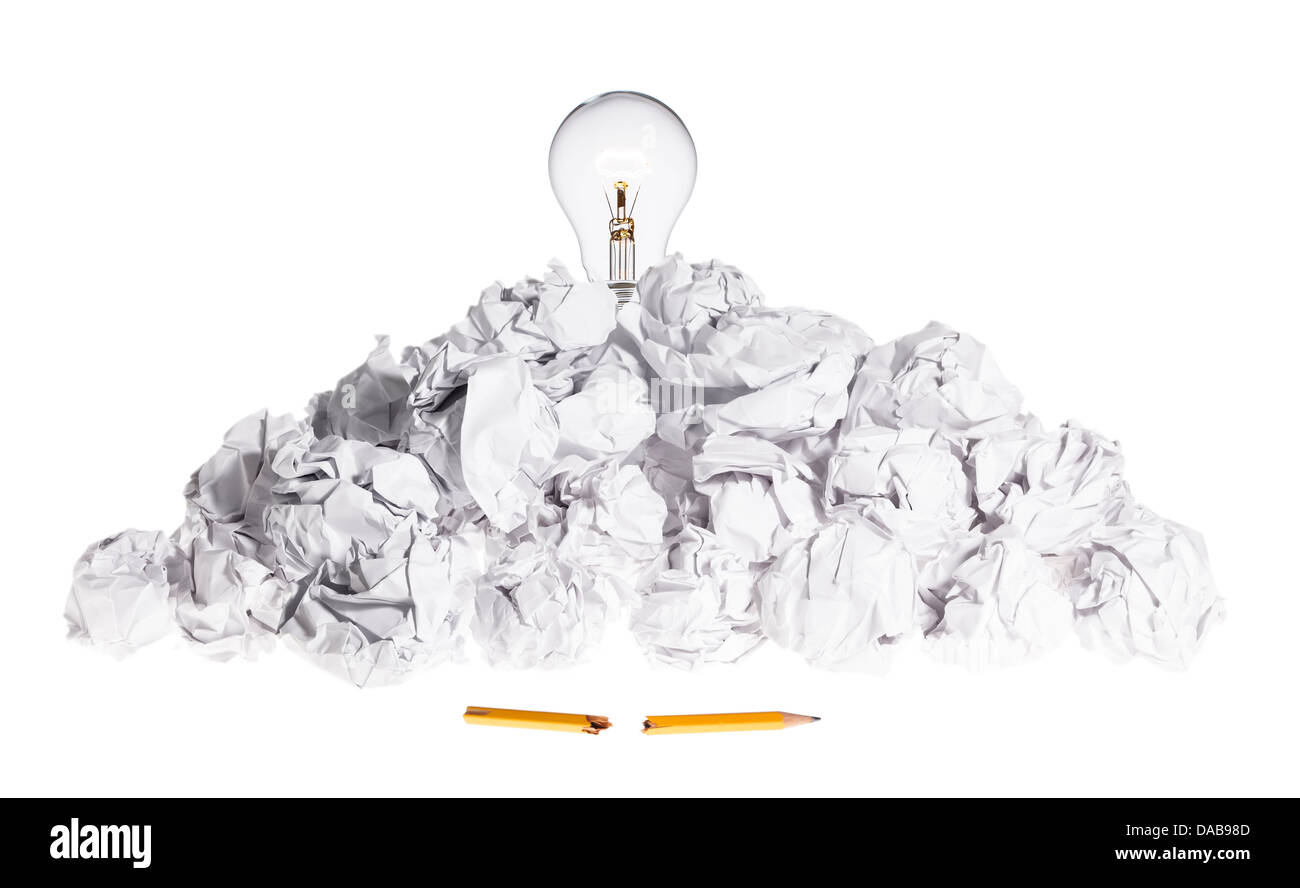 Problem Solving Concept Light Bulb On Pile of Crumpled Paper Stock ...